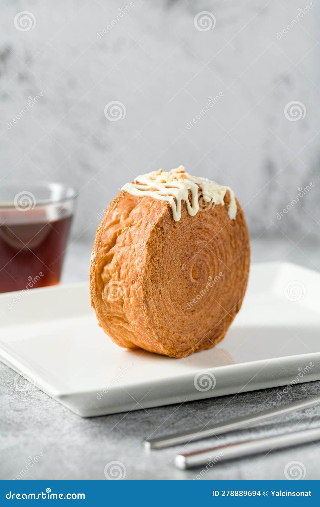 Chocolate New York Roll or Round Croissant with Tea on Stone Table ...