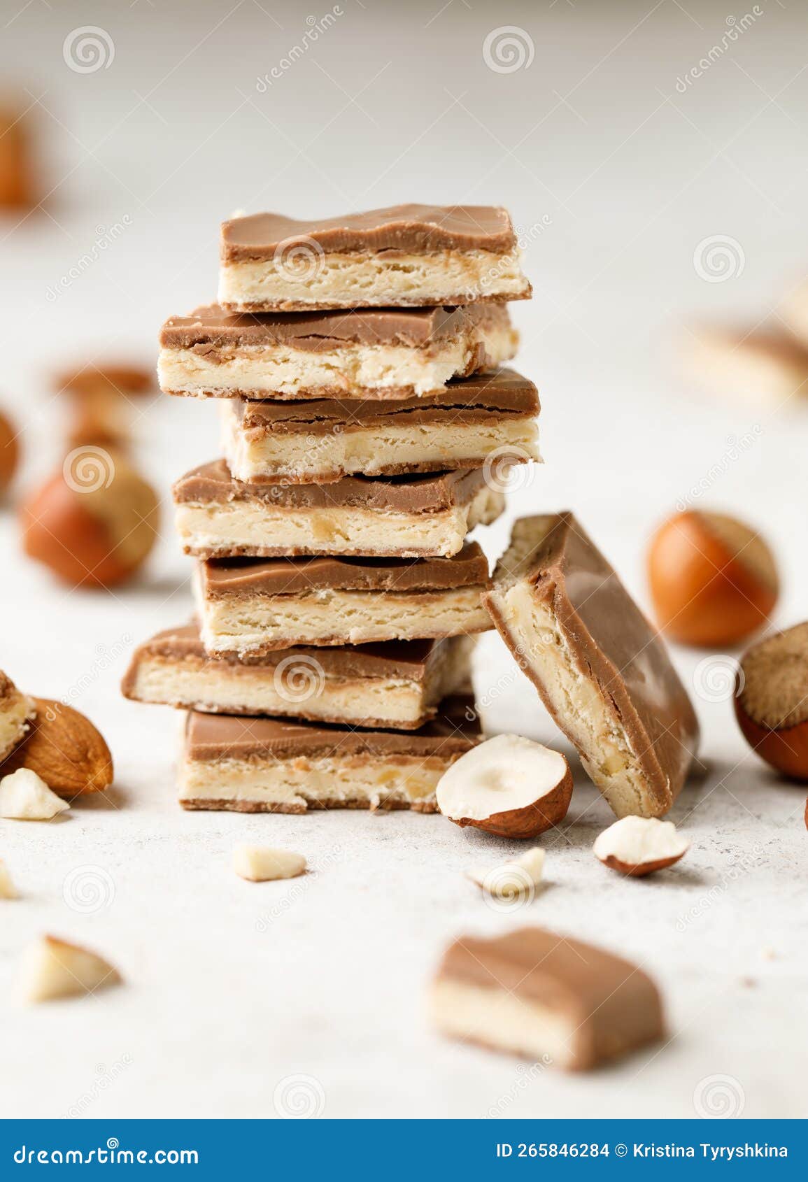 Chocolate Pieces on White Background with Hazelnut. Stack of Chocolate ...