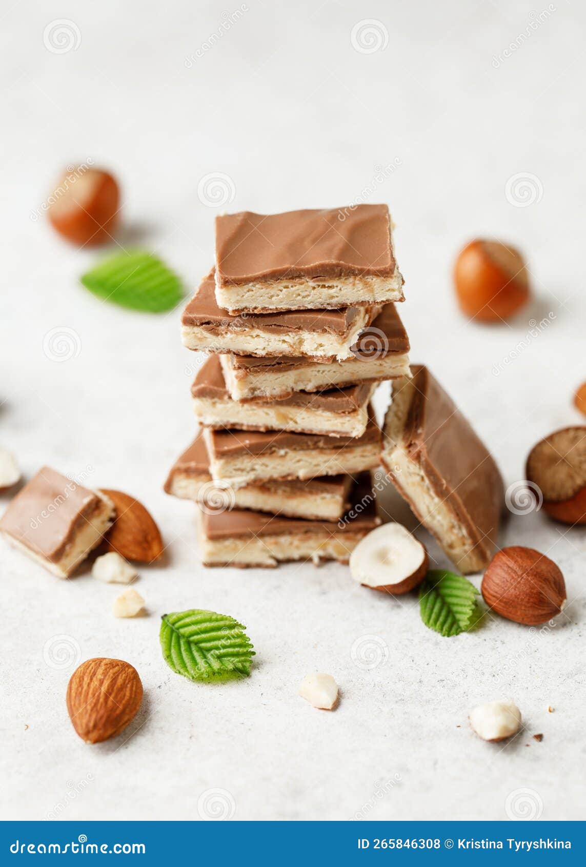 Chocolate Pieces on White Background with Hazelnut. Stack of Chocolate ...