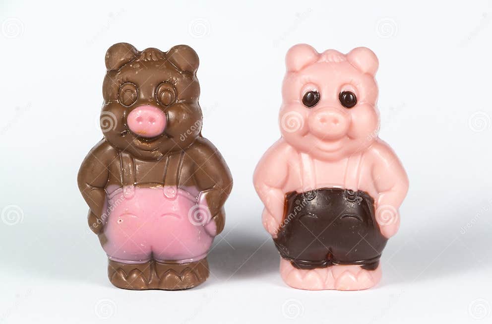 Chocolate pigs for easter stock photo. Image of pink - 176885890