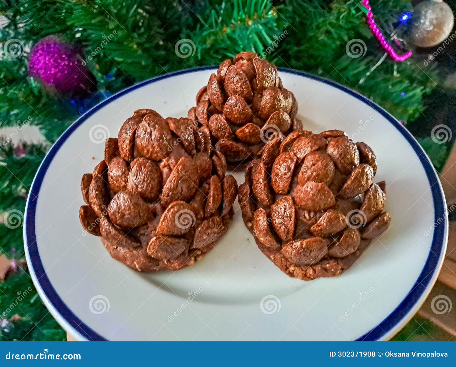 These Chocolate Pine Cone-shaped Shortbread Cookies on a White Plate ...