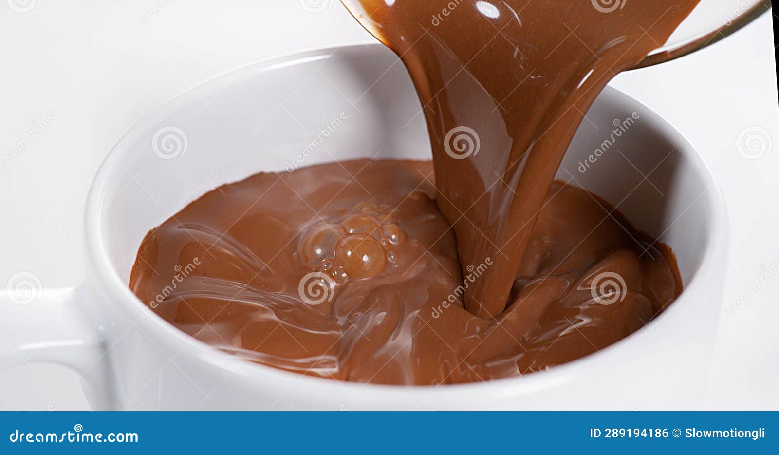Chocolate Pouring into a Bowl Against White Background Stock Photo ...