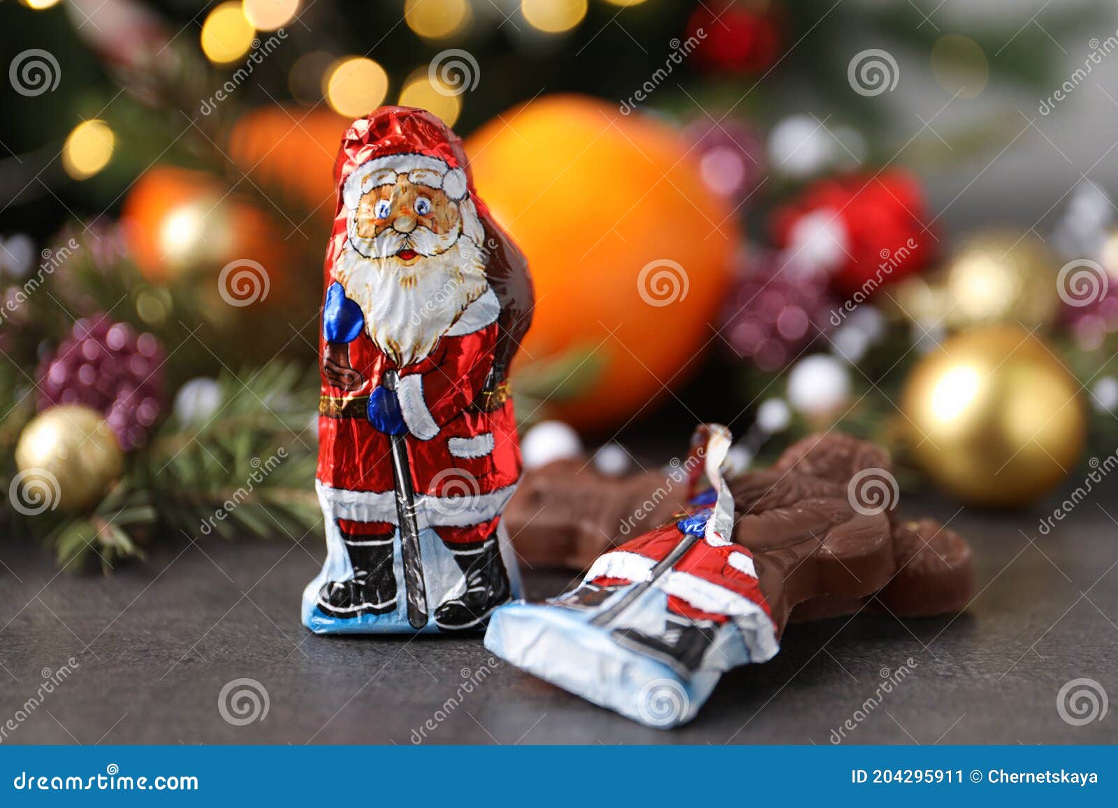 Chocolate Santa Claus Candies on Grey Table Stock Image - Image of ...