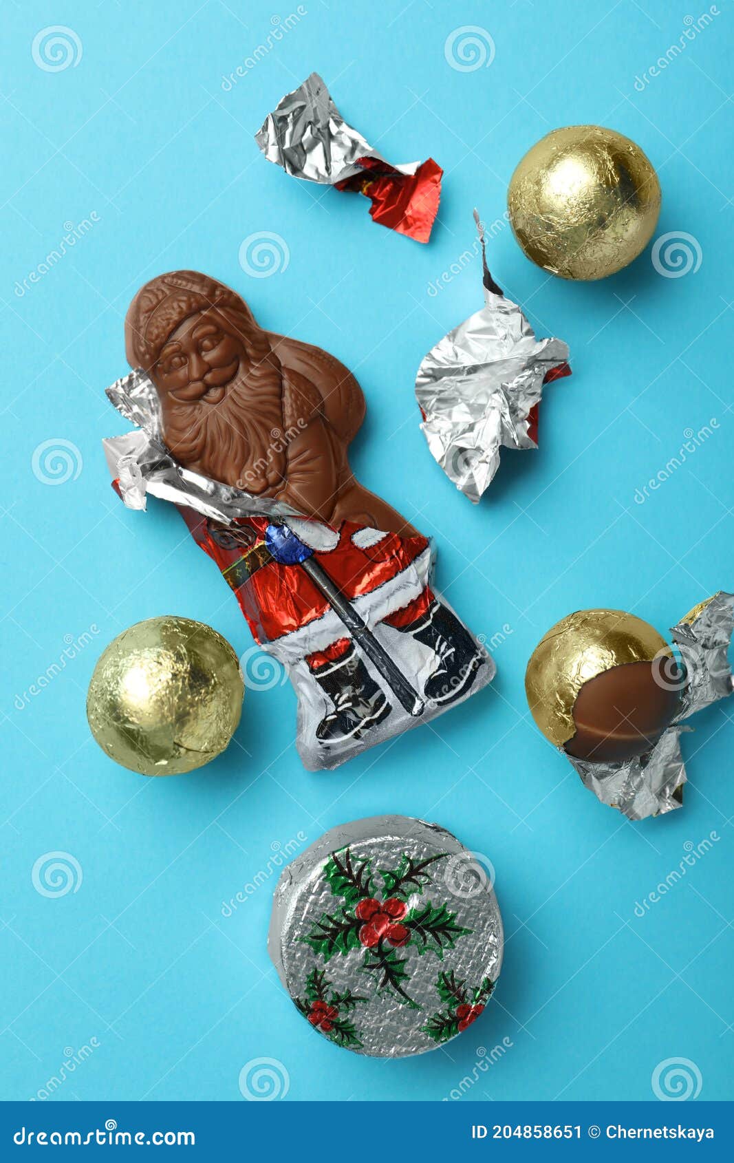 Chocolate Santa Claus and Sweets on Light Blue Background, Flat Lay ...