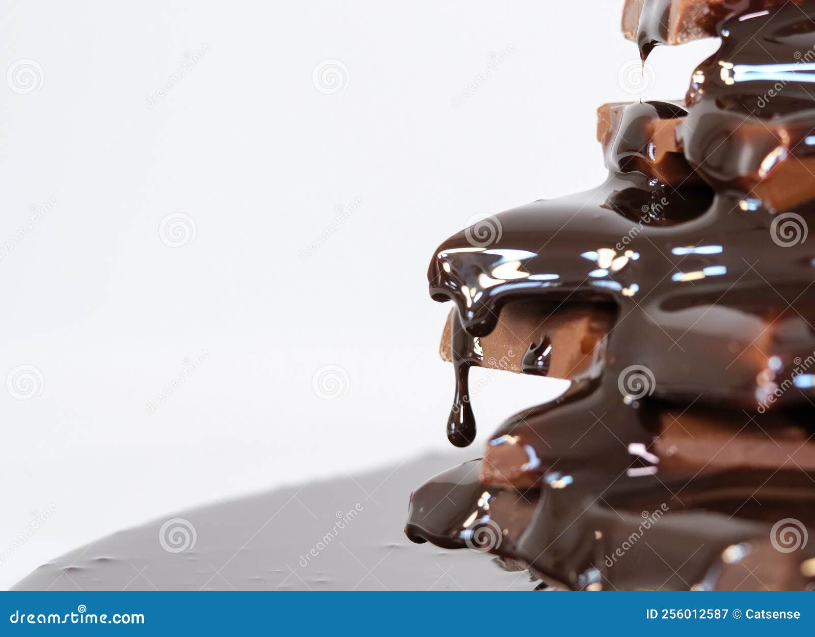 Chocolate Sauce Flowing Over Chocolate Pieces Stock Image - Image of ...
