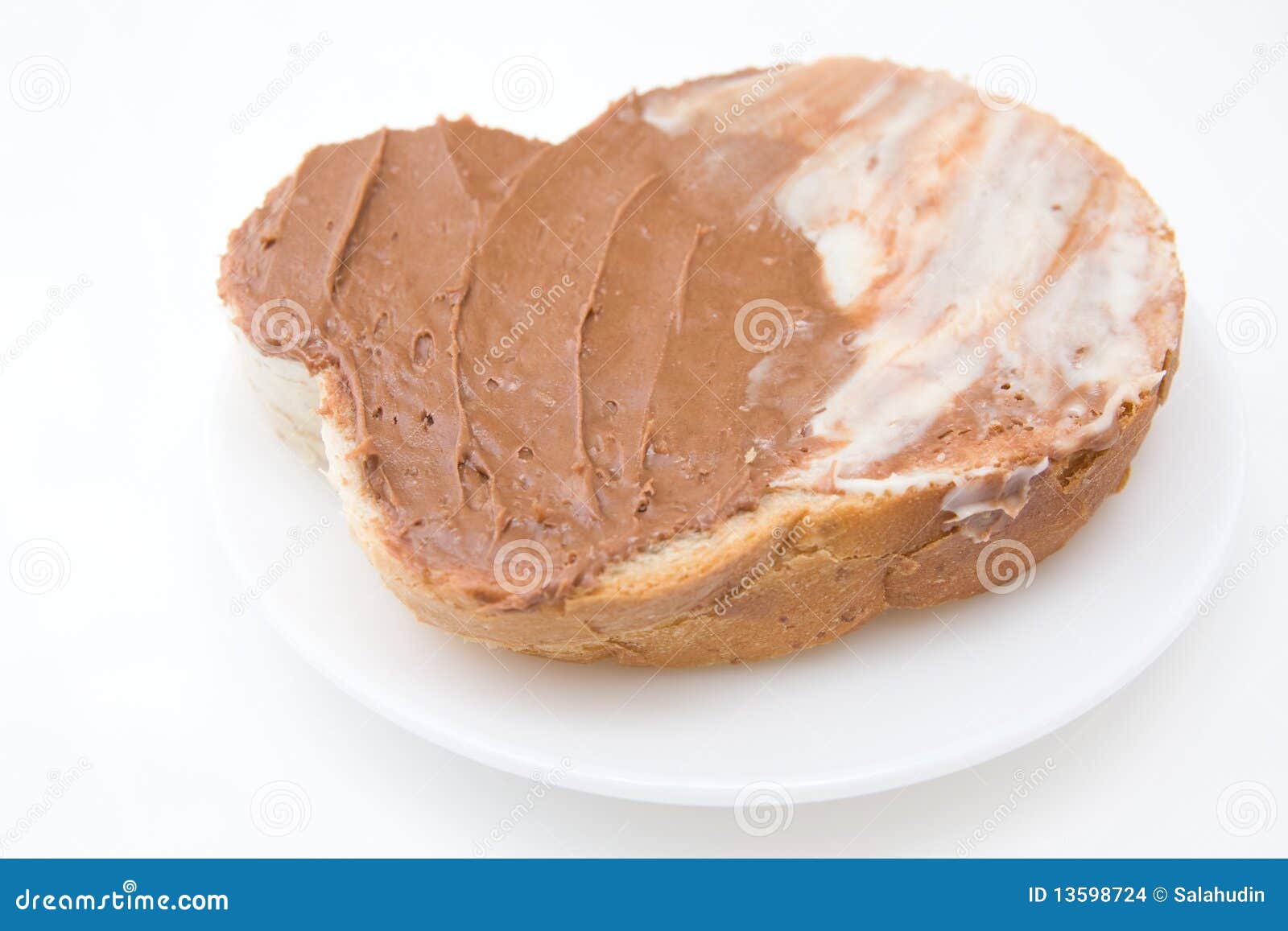 Chocolate spread on bread stock photo. Image of nugat - 13598724