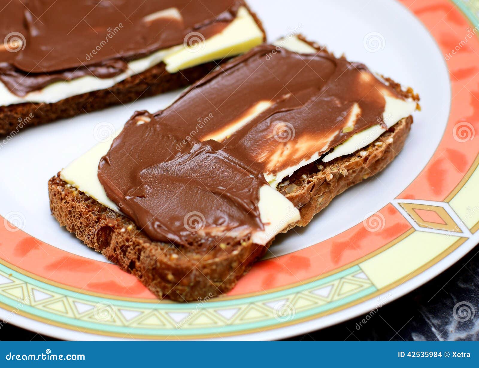 Chocolate spread on bread stock photo. Image of plate - 42535984