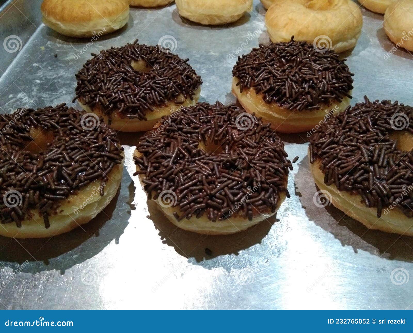 Chocolate sprinkle donuts stock photo. Image of donuts - 232765052