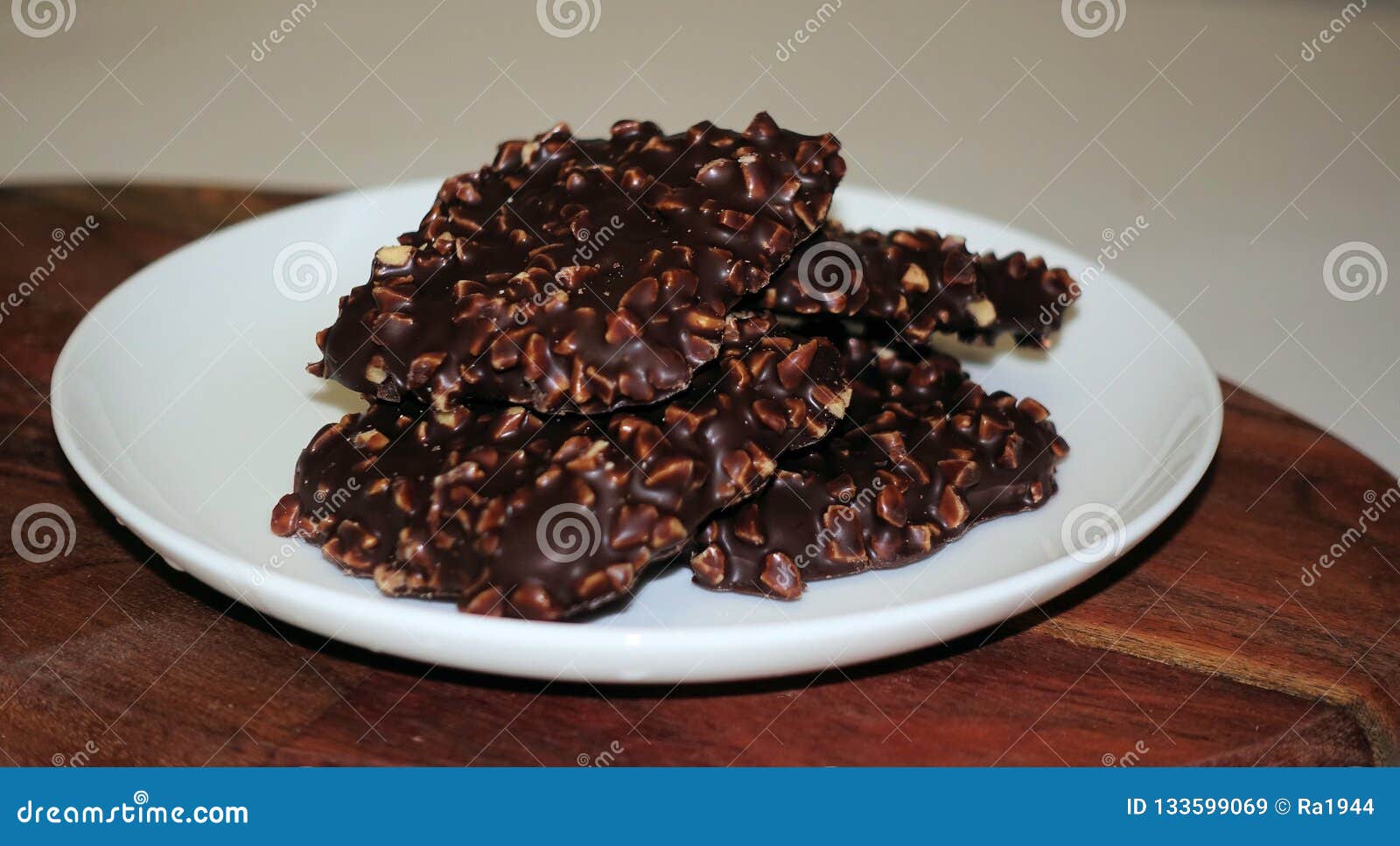 Chocolate Square Biscuits with Nuts on a White Round Plate Stock Image ...