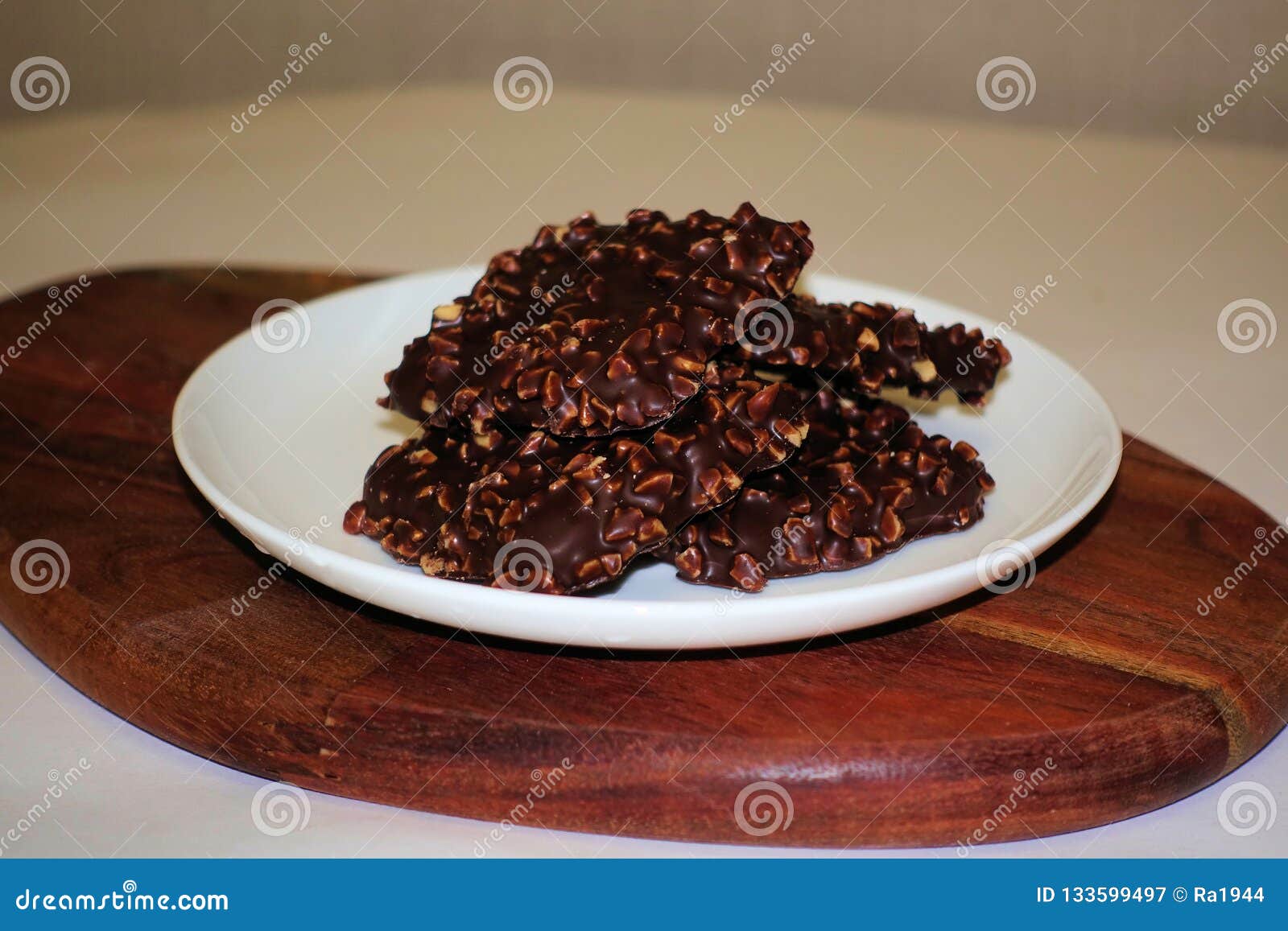 Chocolate Square Biscuits with Nuts on a White Round Plate Stock Image ...