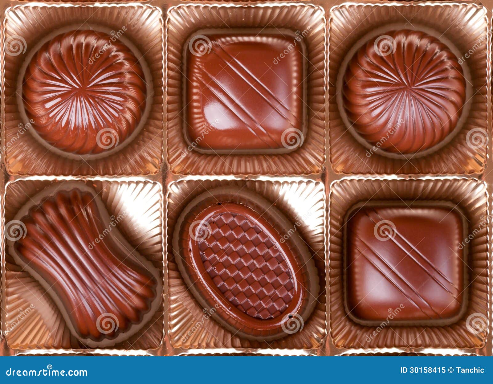 Chocolate Sweets Lie in the Cells of the Boxes Stock Image - Image of ...