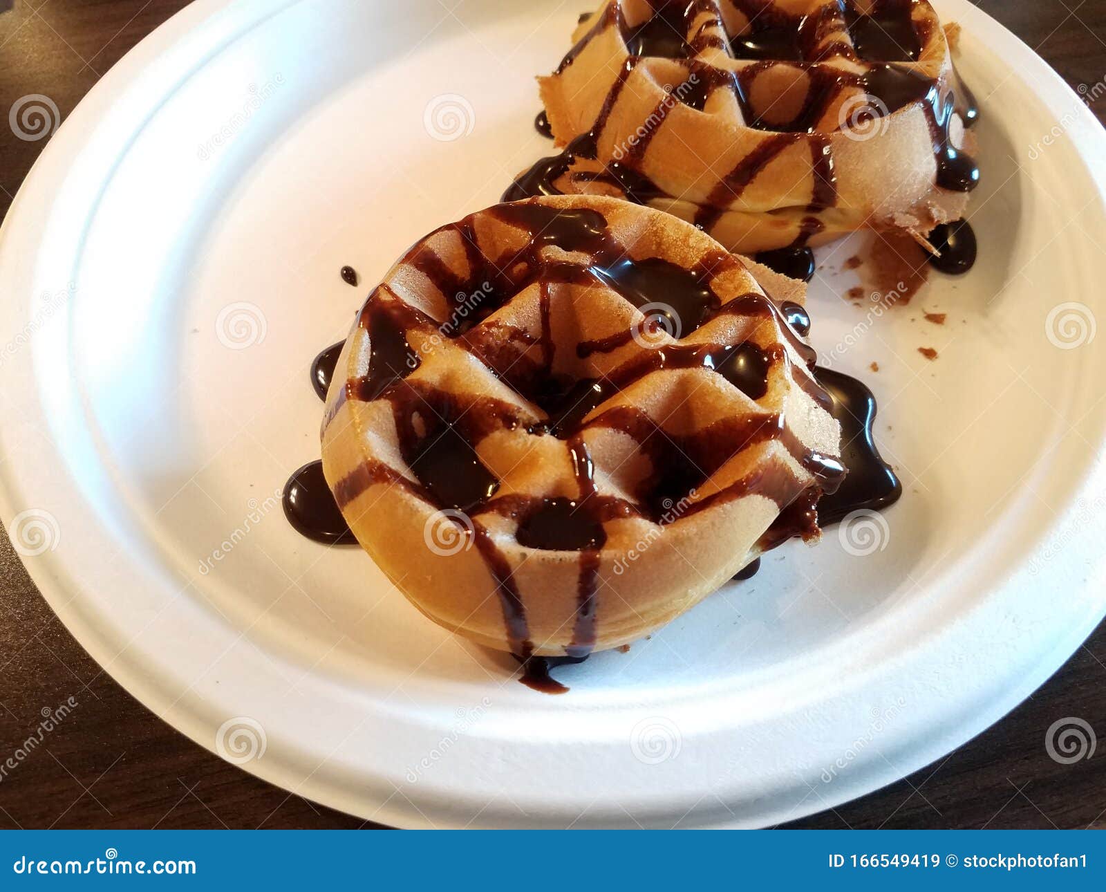 Chocolate Syrup Liquid on Waffles on White Plate Stock Image - Image of ...