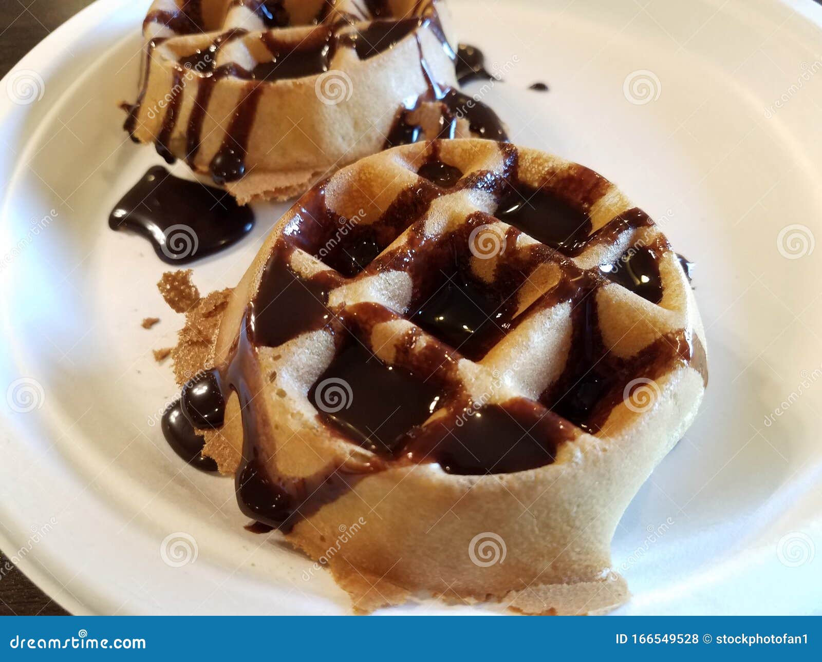 Chocolate Syrup Liquid on Waffles on White Plate Stock Photo - Image of ...
