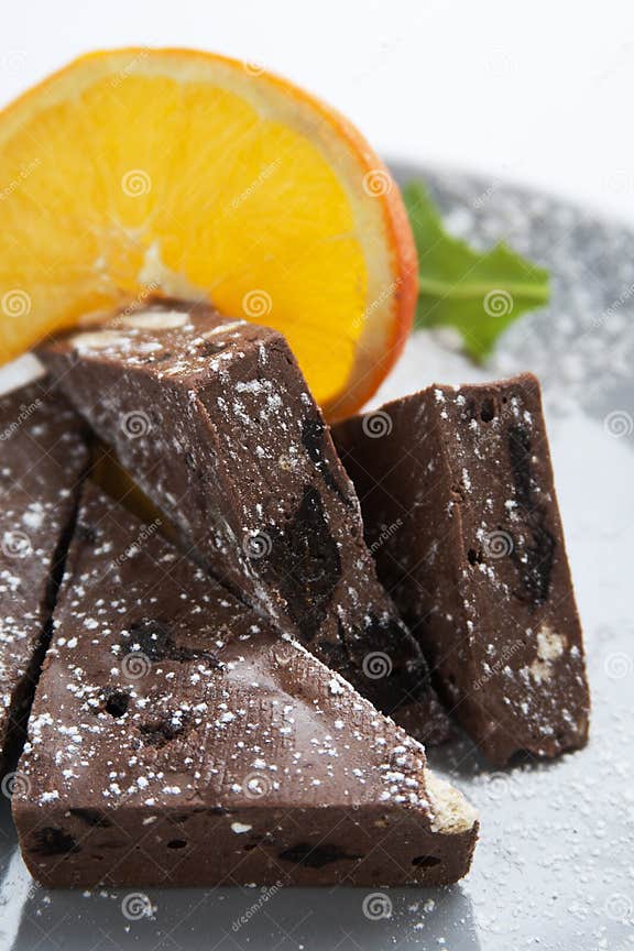 Chocolate Triangles and Orange Slice Stock Image - Image of desserts ...