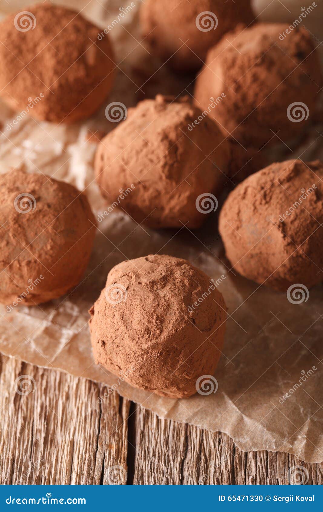 Chocolate Truffles Close-up on a Wooden Table. Vertical Stock Photo ...