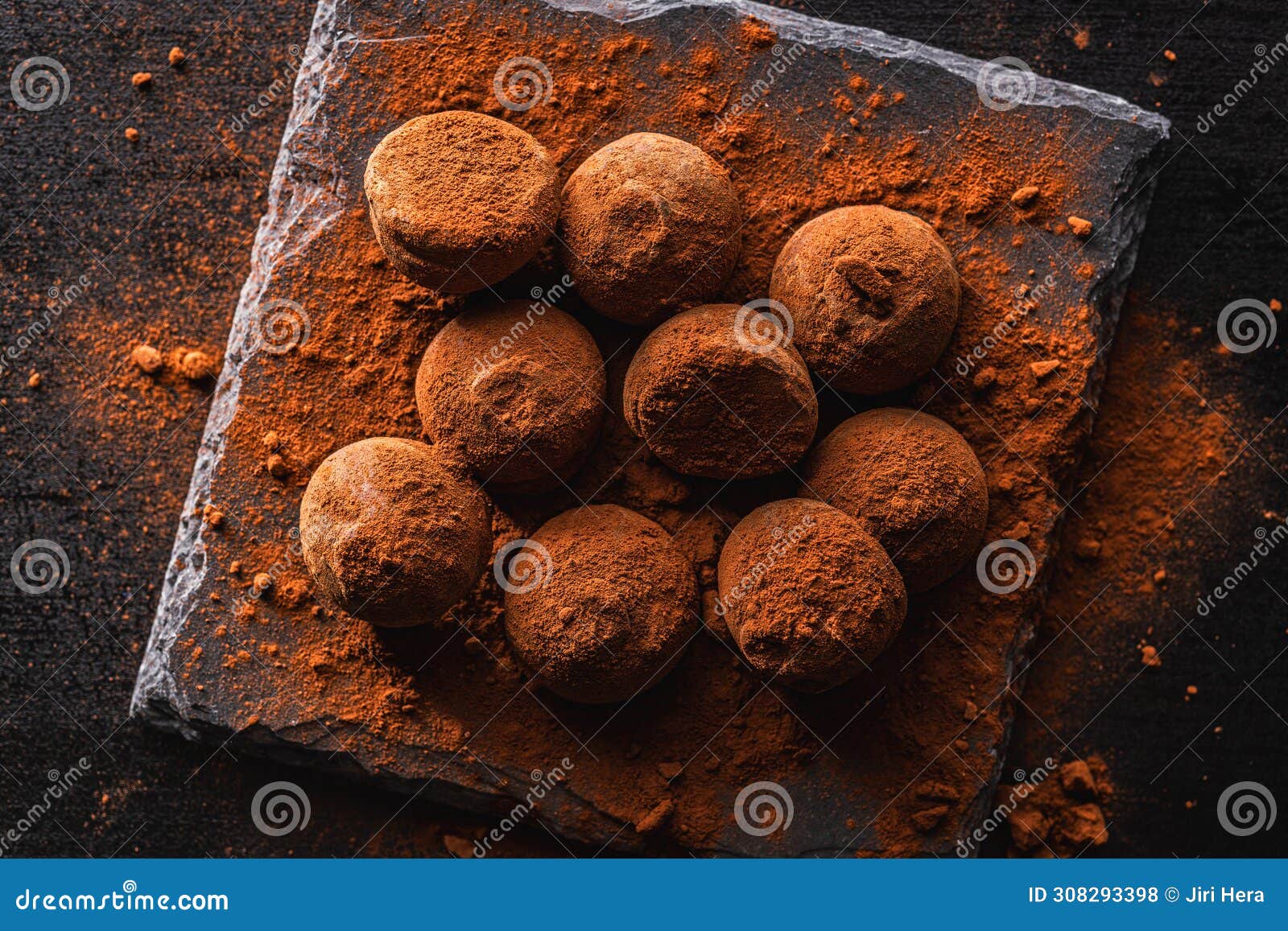 Chocolate Truffles Covered with Cocoa Powder on Black Table. Top View ...