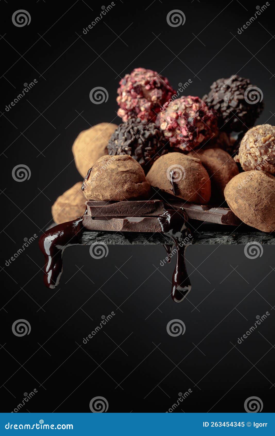 Chocolate Truffles and Falling Drops of Chocolate Sauce Stock Image ...