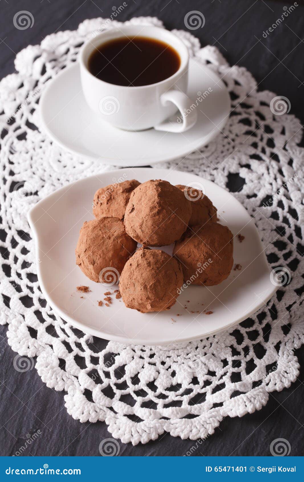 Chocolate Truffles on a Plate and Coffee on the Table. Vertical Stock ...
