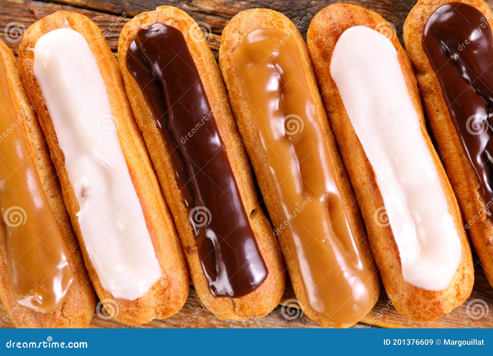 Chocolate, Vanilla and Coffee Eclair Stock Image - Image of wood ...