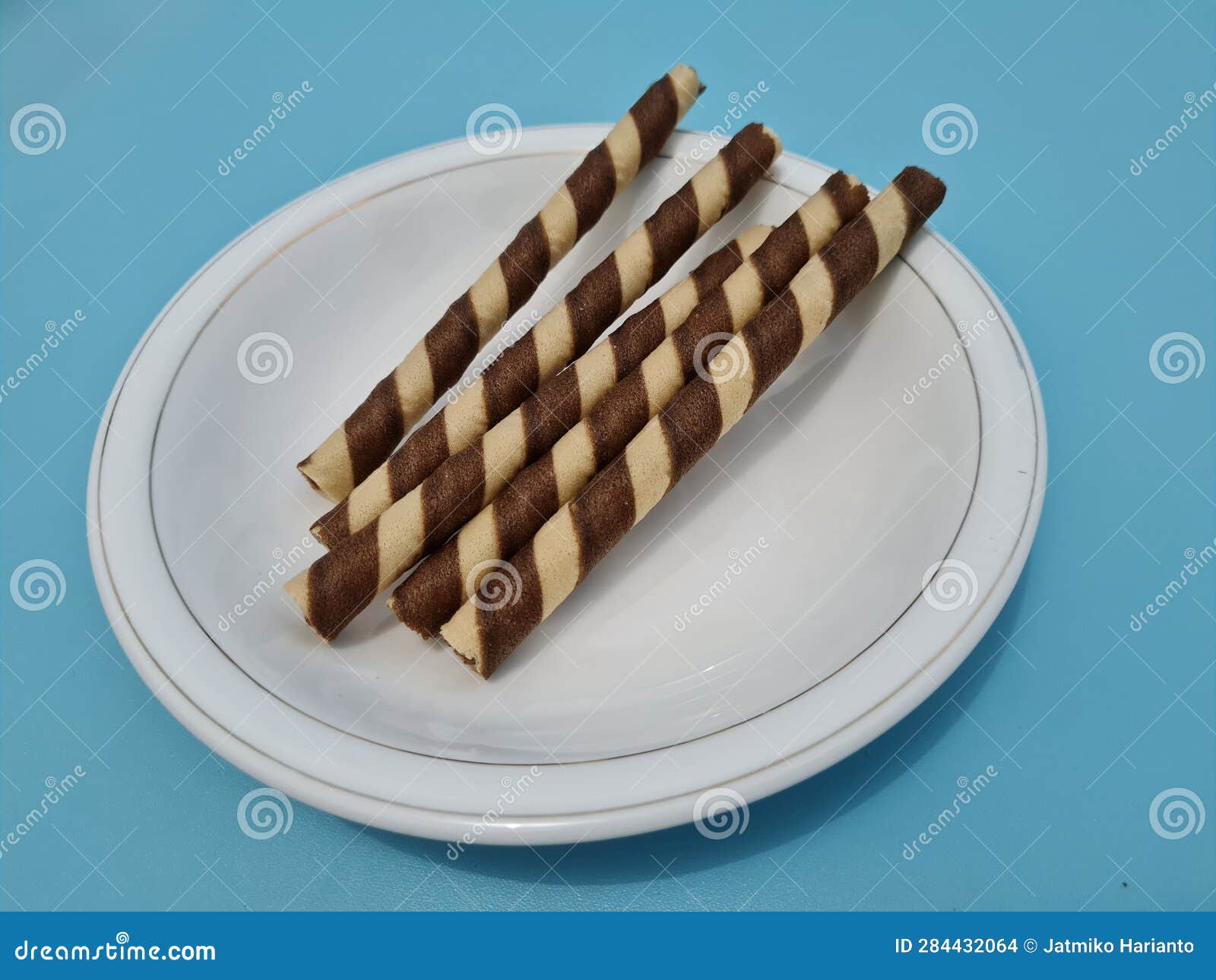Chocolate Wafer Rolls on a Blue Background, Top View. Stock Photo ...