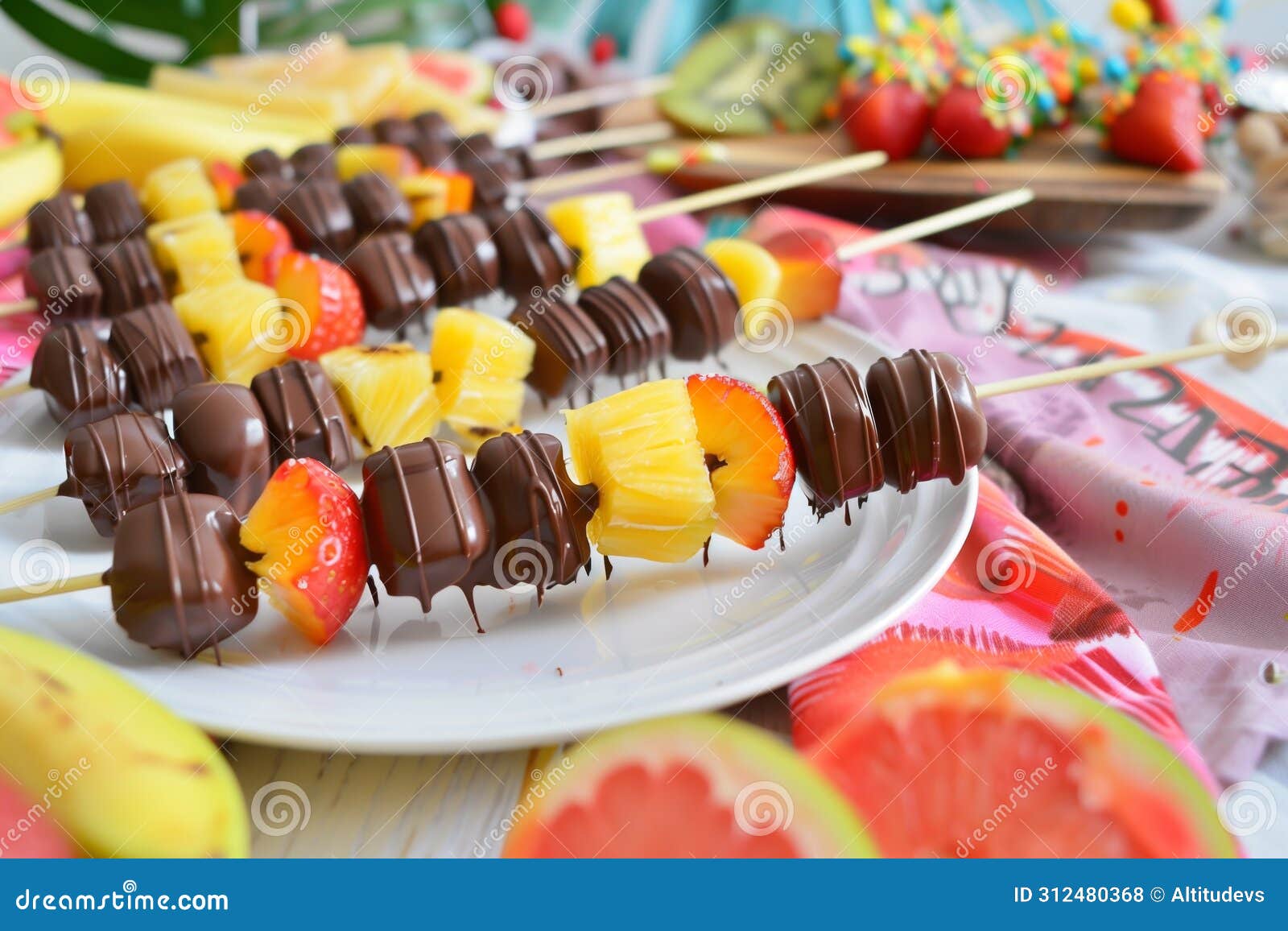 Chocolatedipped Tropical Fruit Kabobs Displayed on a Festive Party ...
