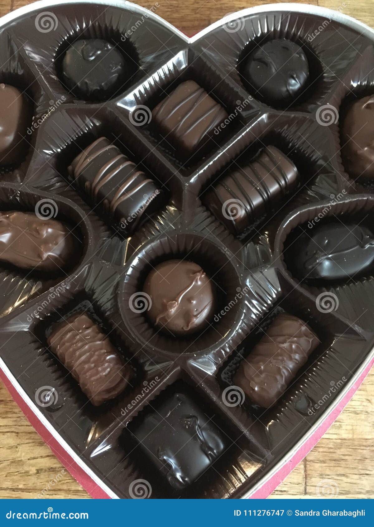 Chocolates in a Heart-Shaped Box Stock Image - Image of dark, candy ...