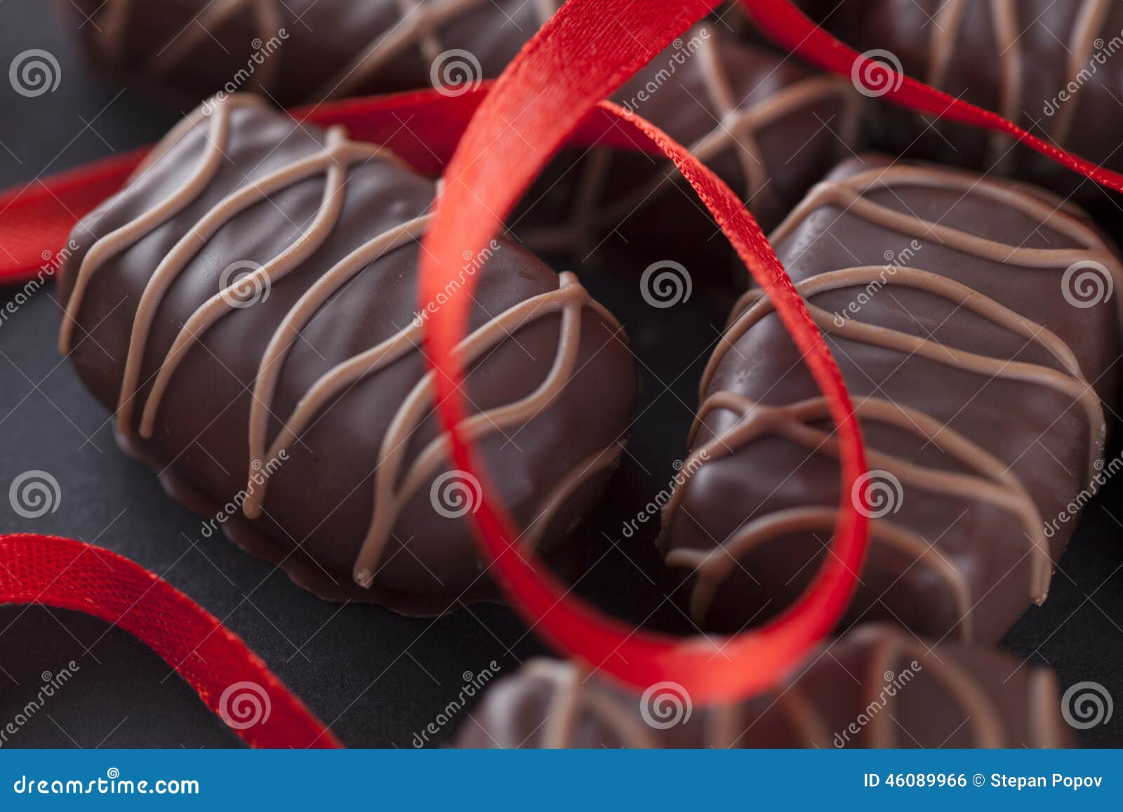 Chocolates and Red Ribbon stock photo. Image of candy - 46089966