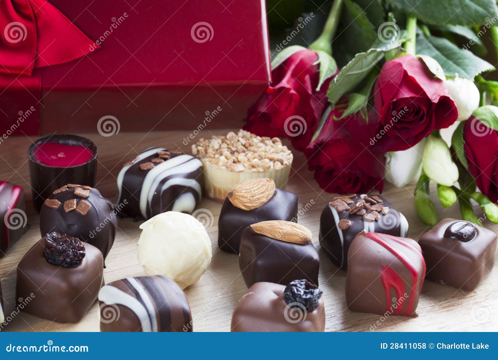 Chocolates and Red Roses stock photo. Image of romantic - 28411058