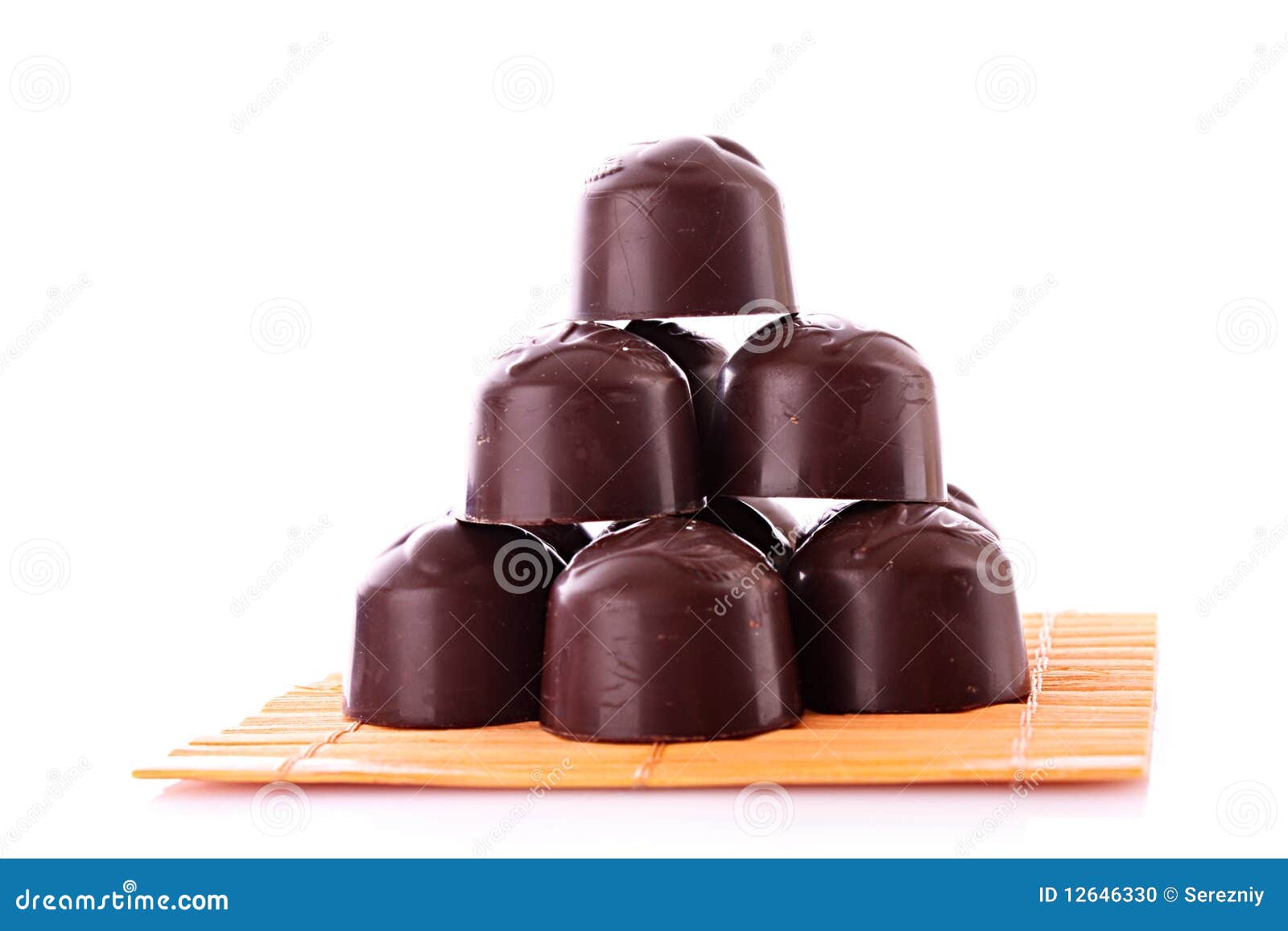 Chocolates on Wooden Surface Stock Photo - Image of closeup, sugar ...