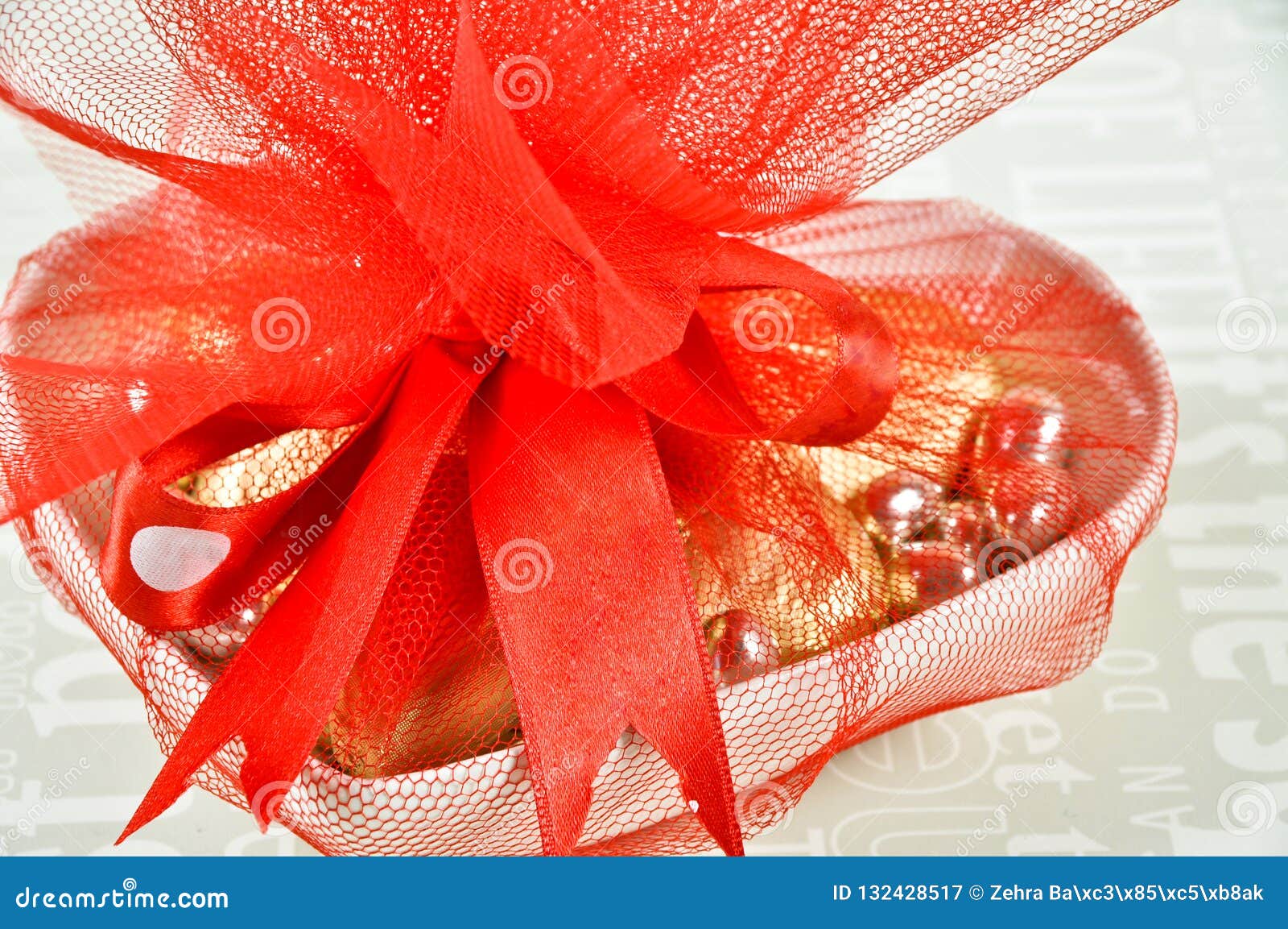 Chocolates Wrapped in Colored Foils Packed with Red Ribbon Stock Image ...