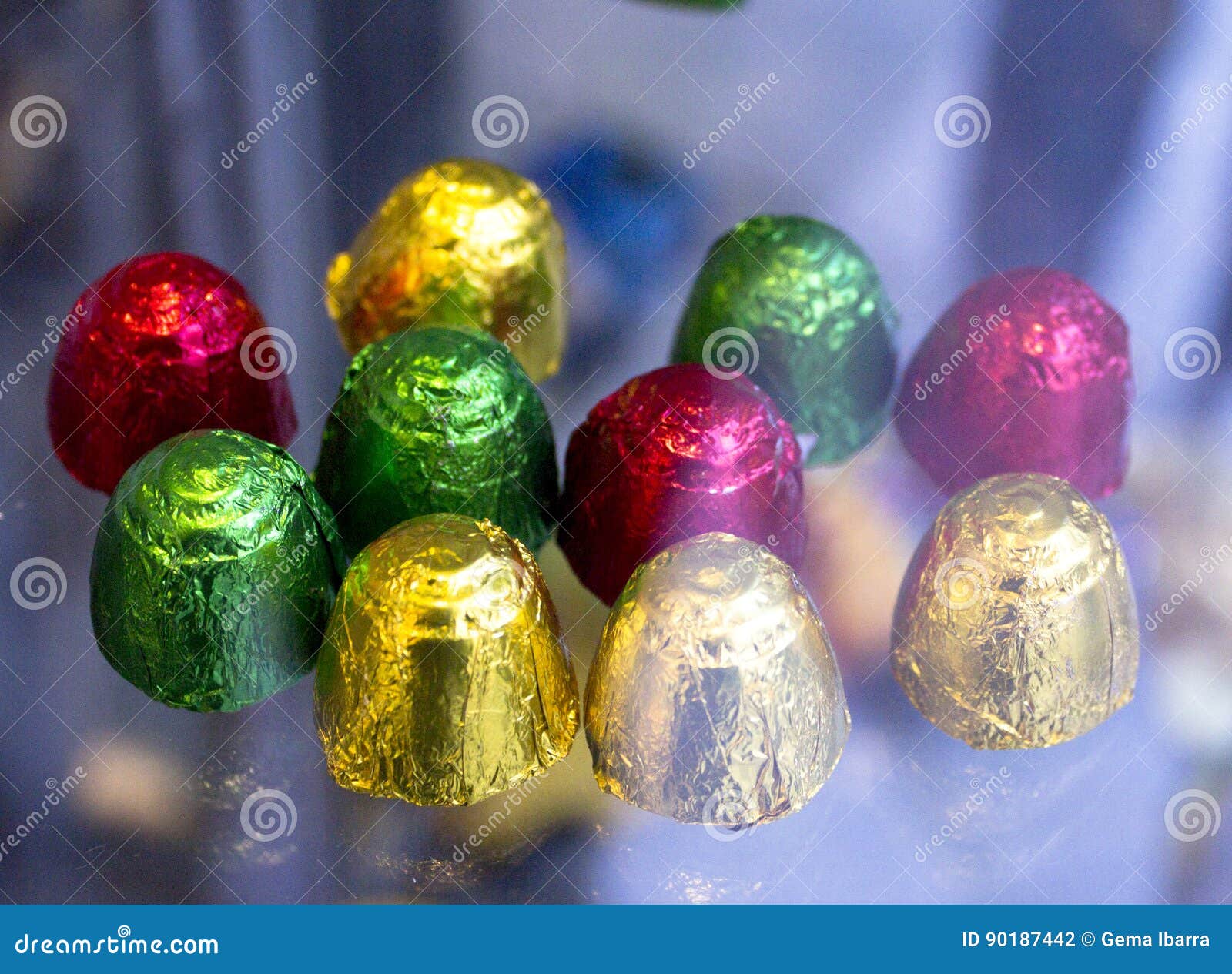 Chocolates wrapped in foil stock photo. Image of green - 90187442
