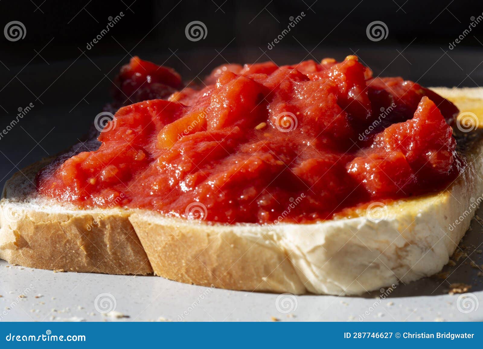 Chopped Cherry Tomatoes on a Slice of White Bread Toast. Stock Image ...