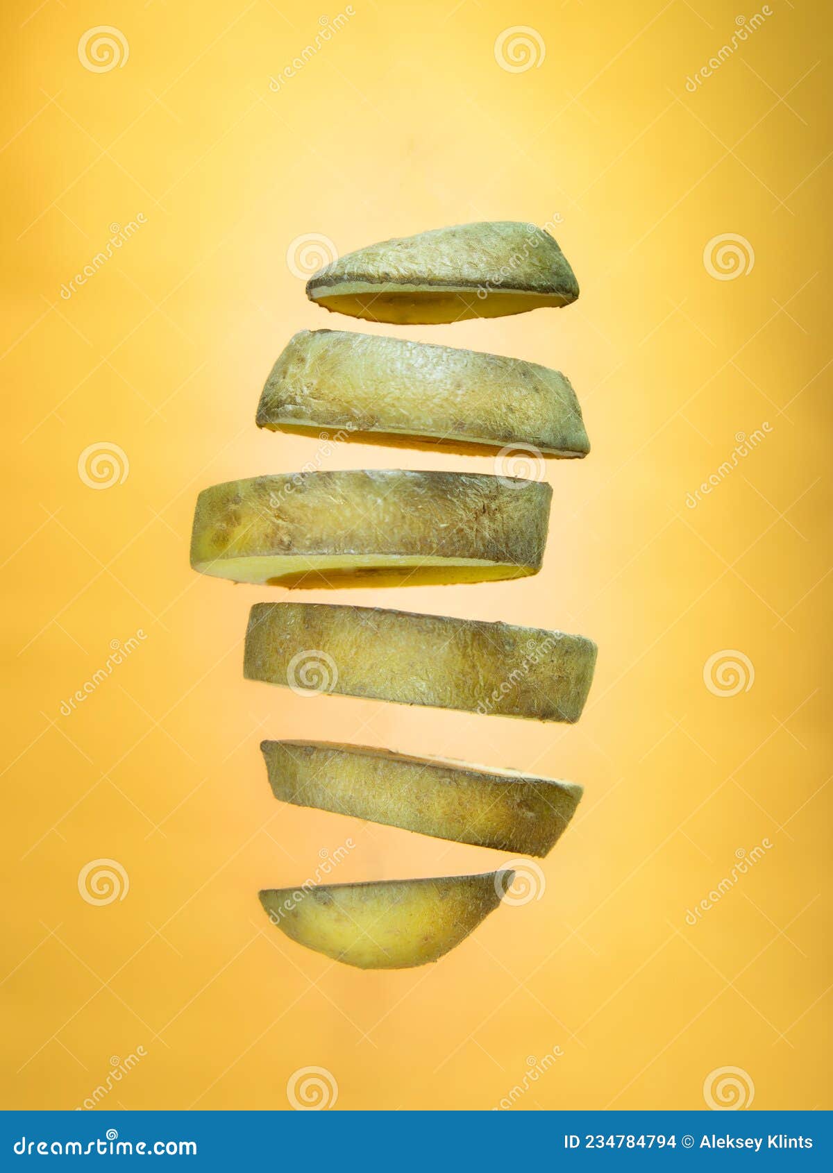 Chopped Floating Potato on Orange Background Stock Photo - Image of ...