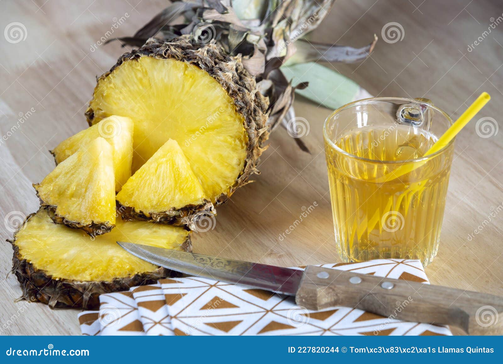 Chopped Pineapple Split in Half with a Wooden Handle Knife and Drawings ...