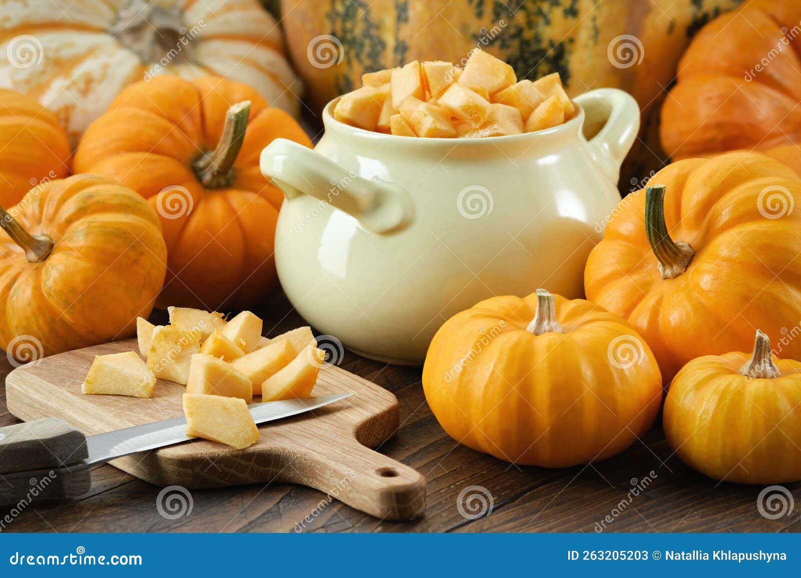 Chopped Pumpkin Pulp on Cutting Board. Saucepan Filled with Chopped ...