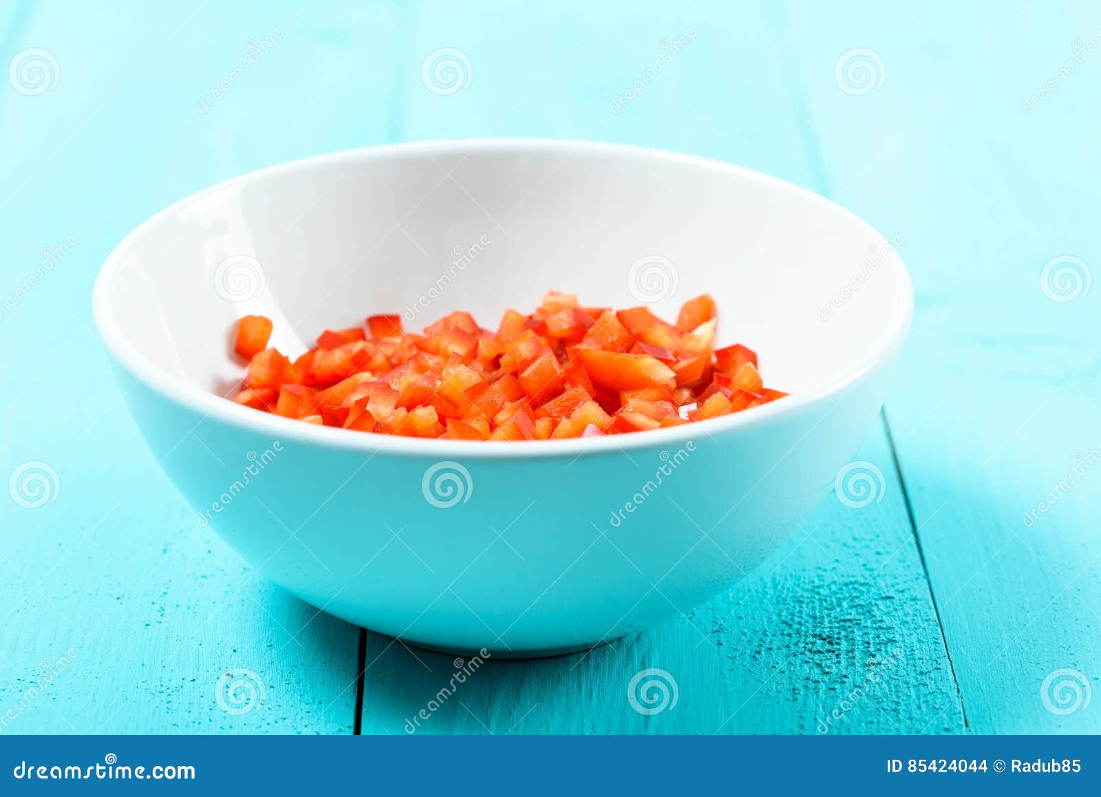 Chopped Red Capsicum in White Bowl Stock Photo - Image of bell ...