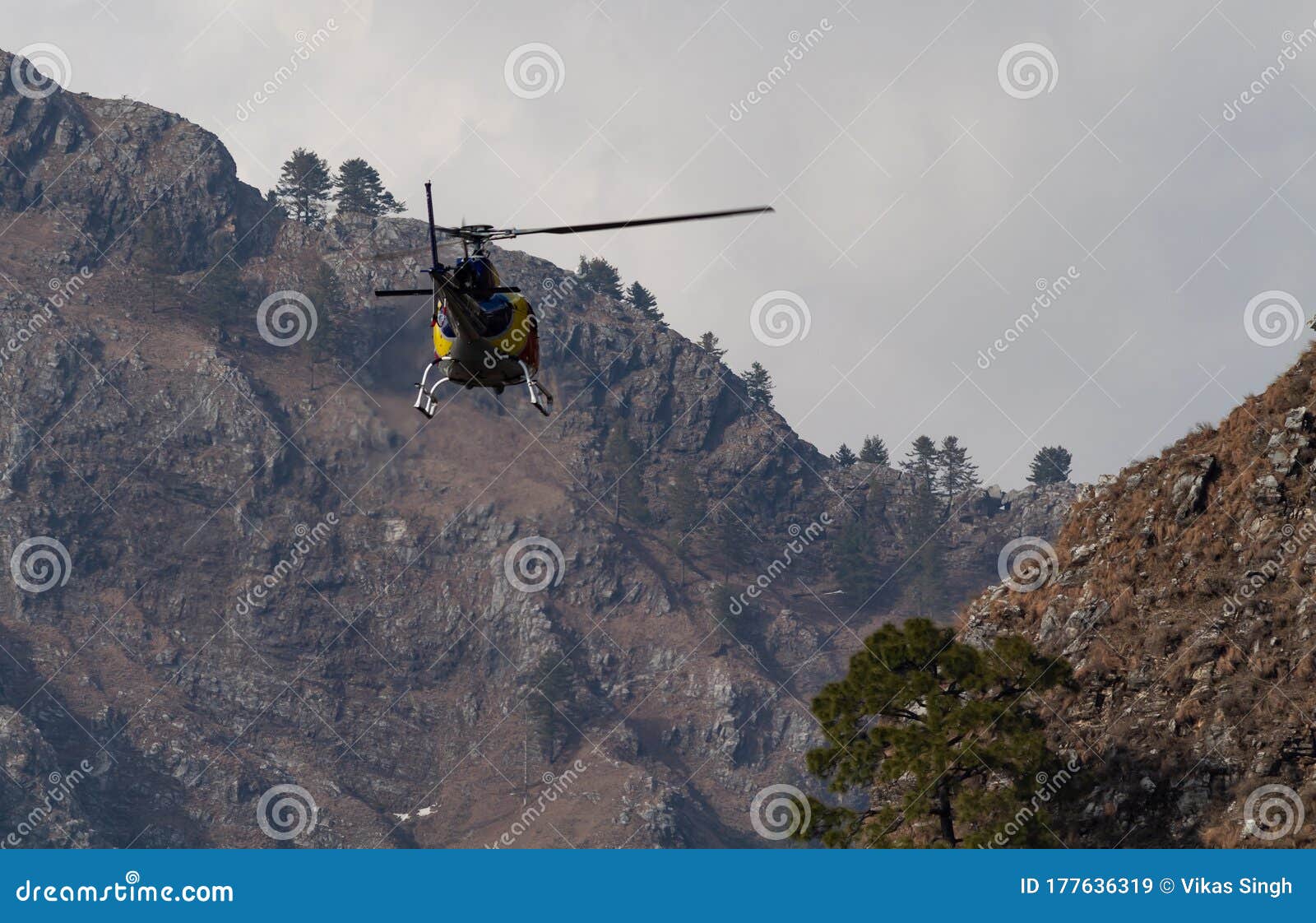 A Chopper Flying from between Mountain Valley in Rescue Operation ...