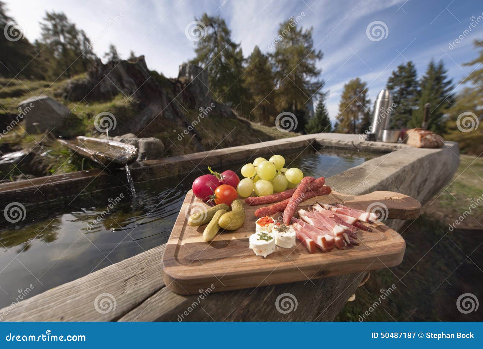Chopping Board with Snacks on Feeding Trough Stock Image - Image of ...