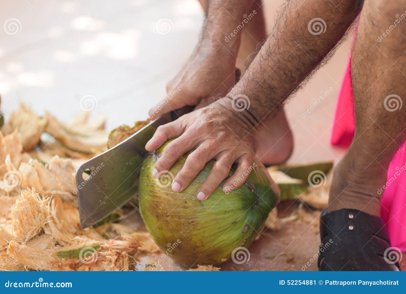 Chopping coconut by knife stock image. Image of husk - 52254881