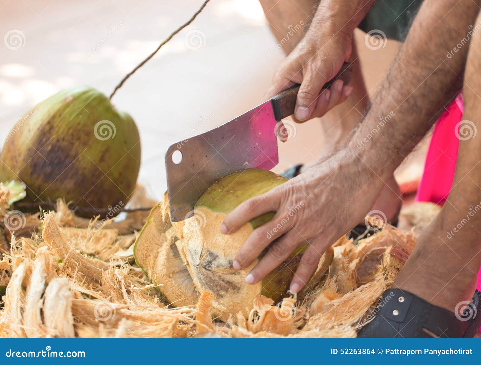 Chopping coconut by knife stock photo. Image of nature - 52263864