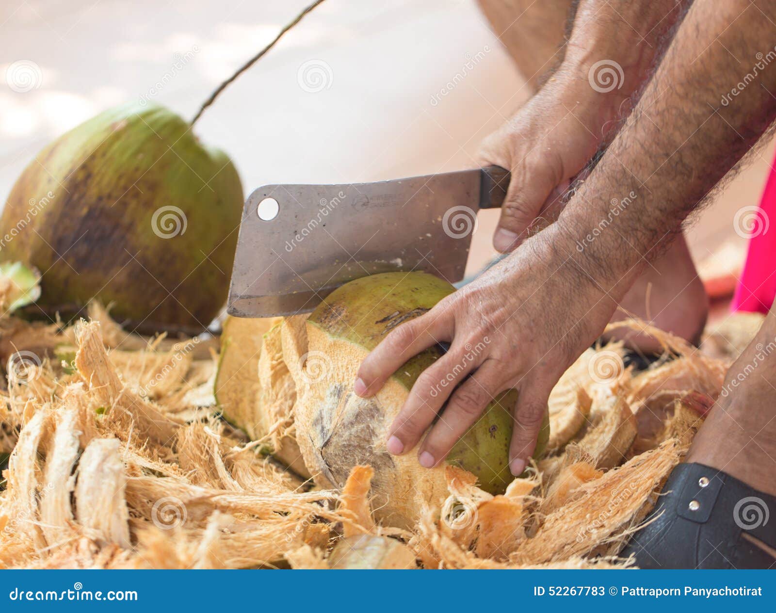 Chopping coconut by knife stock image. Image of green - 52267783