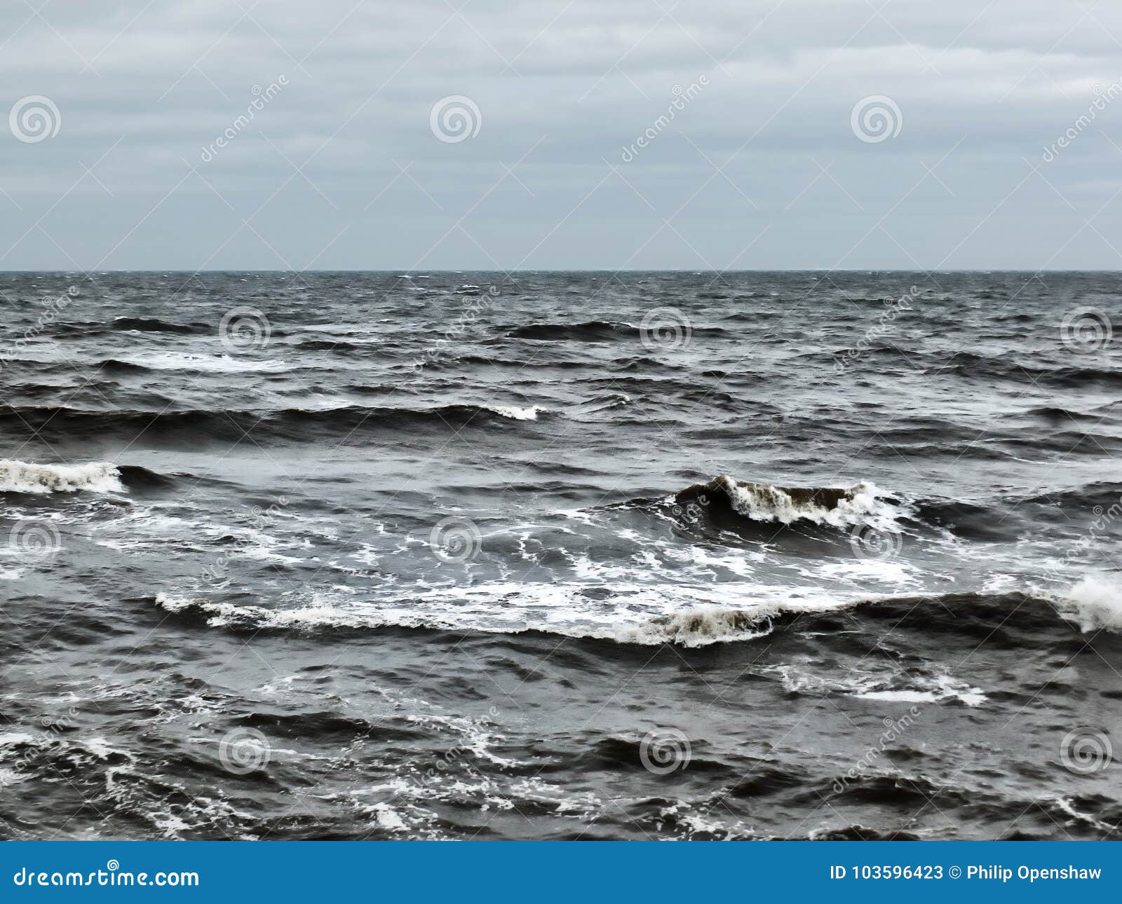 Choppy Atlantic Ocean Waves with Surf and Grey Winter Clouds Stock ...