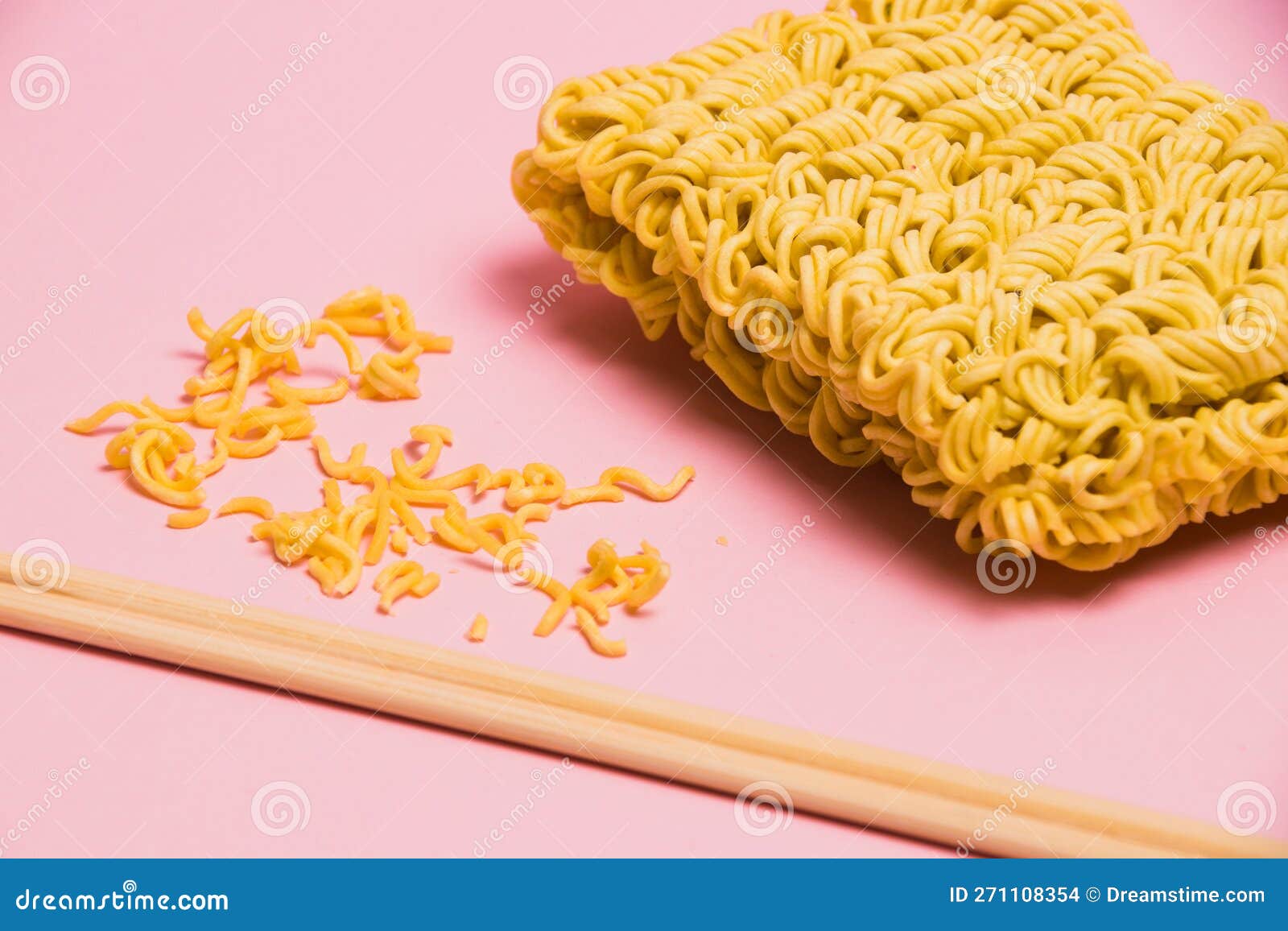 Chopsticks and Raw Instant Noodles on Pink Background, Side View Stock ...