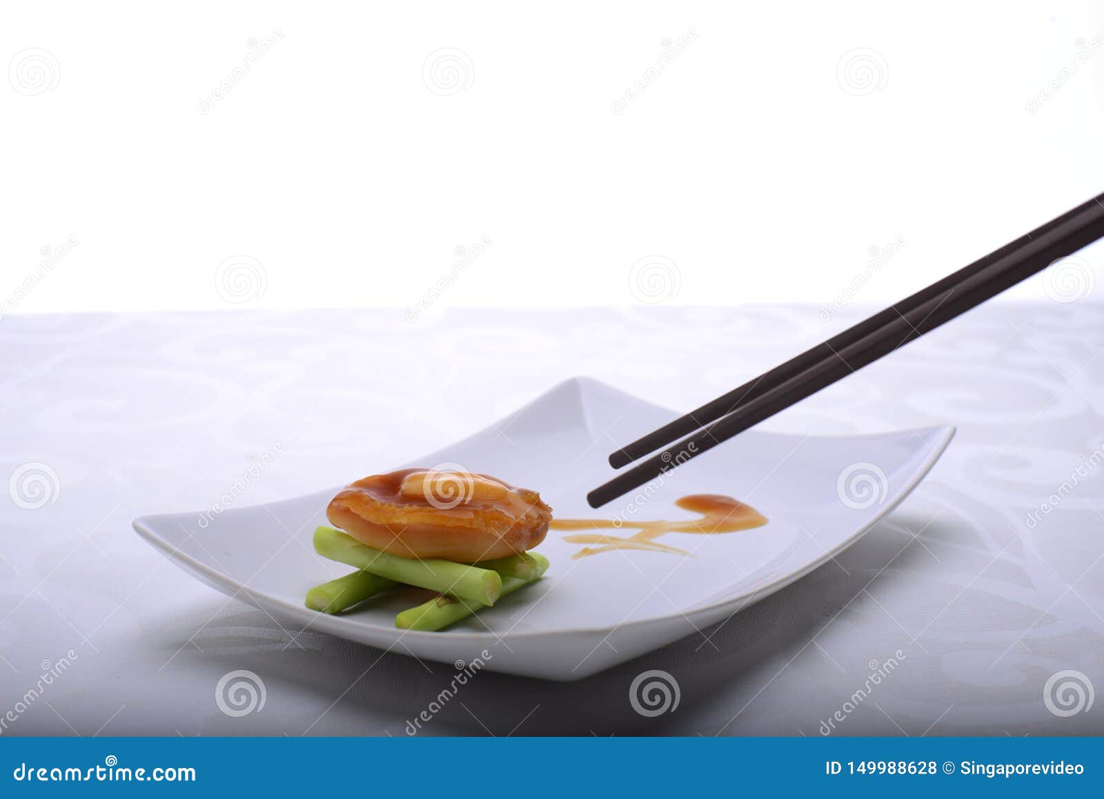 Chopsticks Taking Abalone in a Restaurant Where Presentation is ...