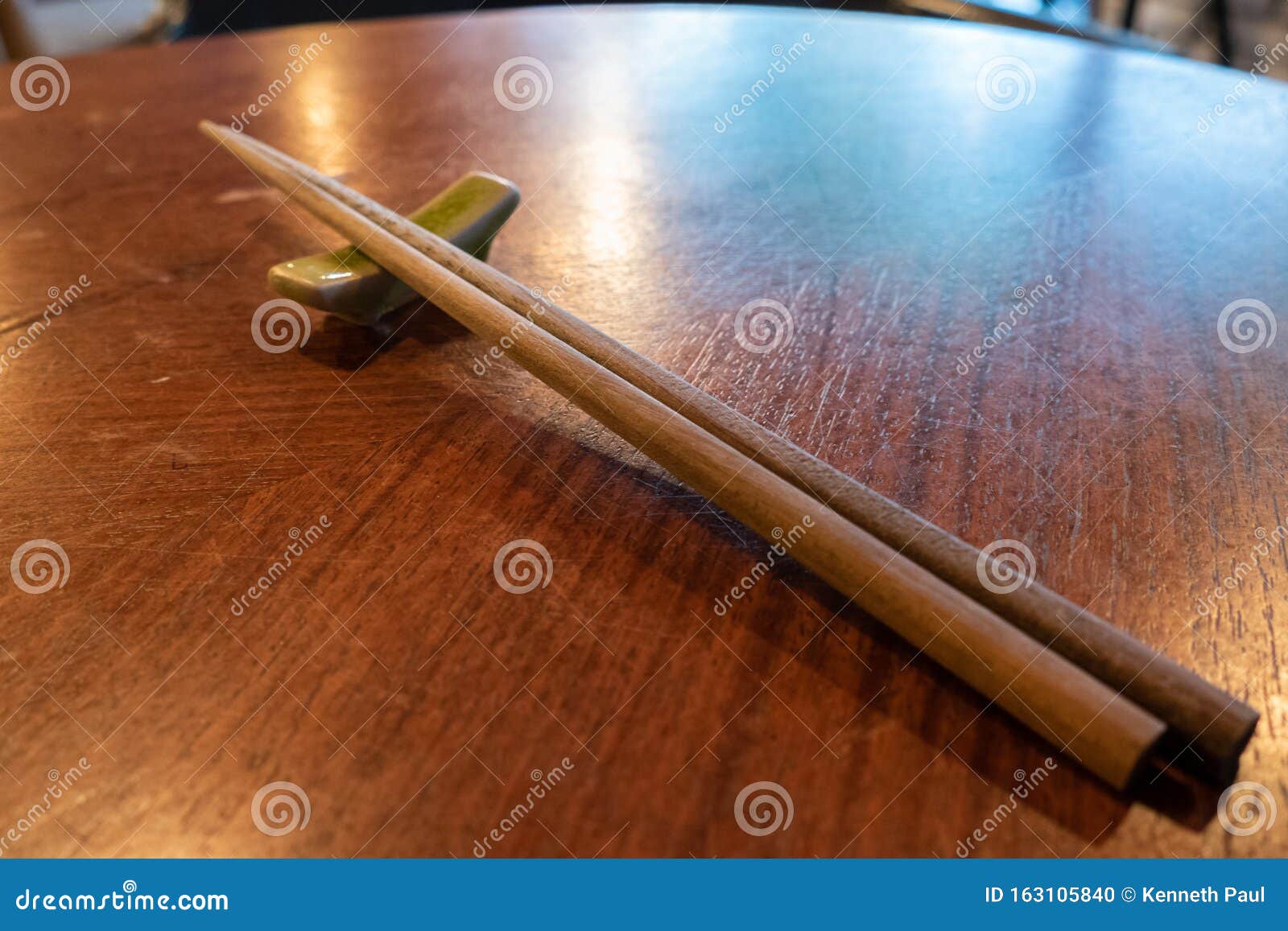 Chopsticks on wood table stock photo. Image of food - 163105840
