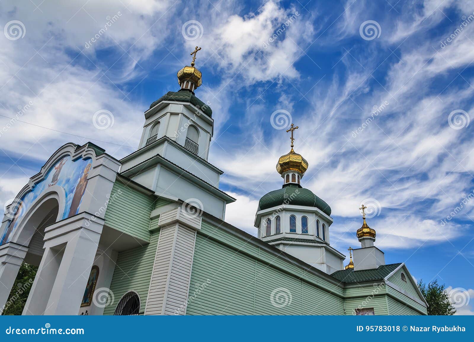 Christian Temple and Golden Domes Against the Sky with Clouds Stock ...