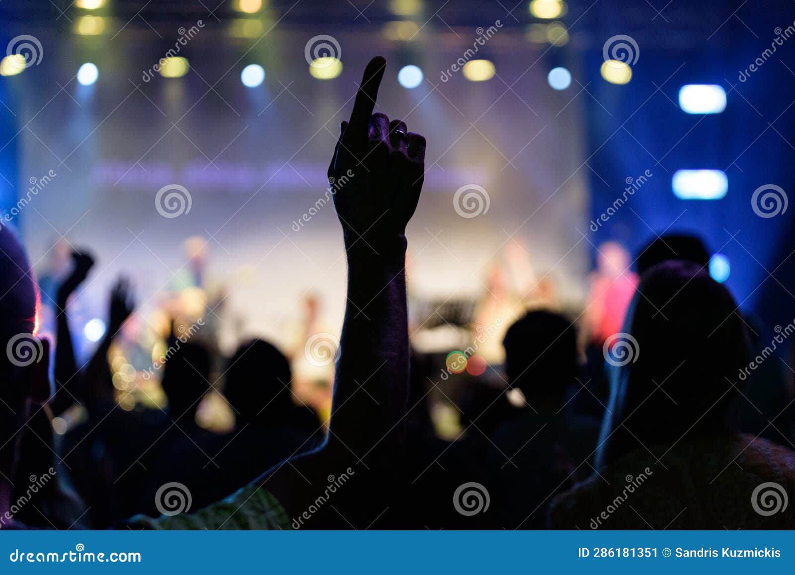 Christians Raising Their Hands In Praise And Worship At A Night Music ...