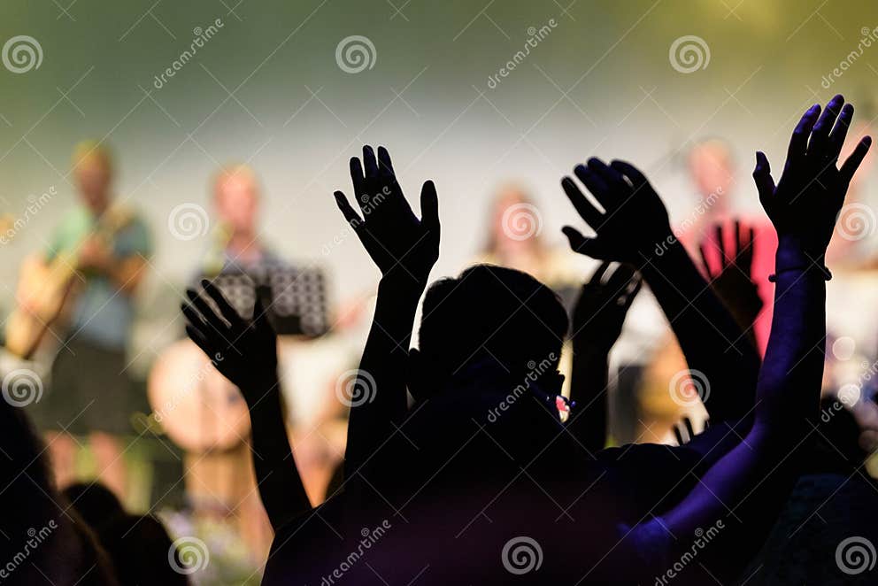 Christians Raising Their Hands In Praise And Worship Stock Image