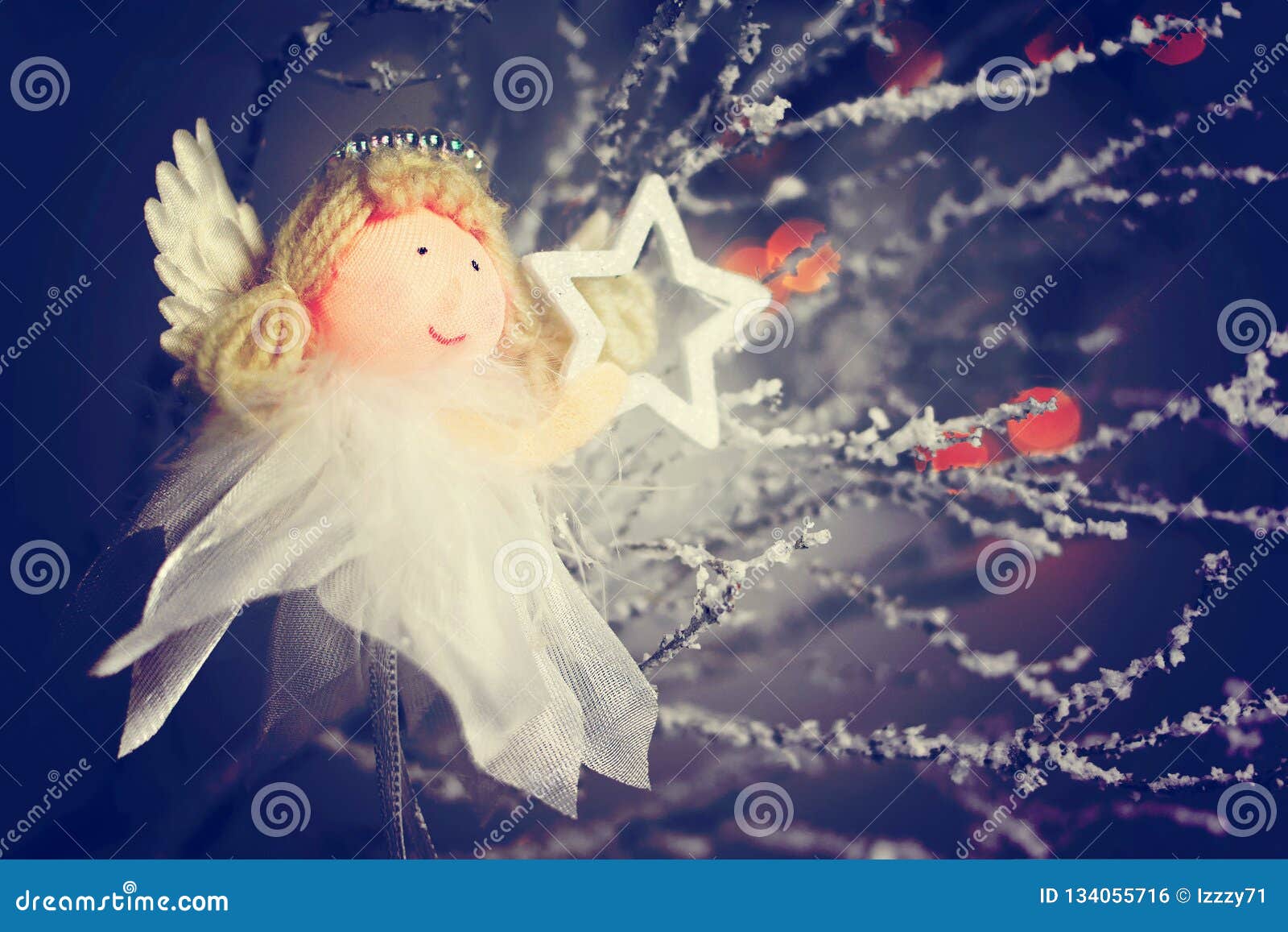Christmas Angel Holding a Star Stock Photo - Image of blurred, seasonal ...