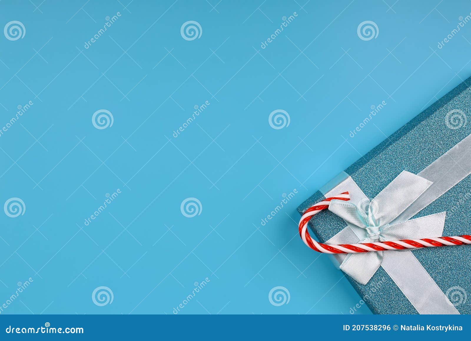 Christmas Background. Blue Glitter Gift Box with Bow and Striped Candy ...